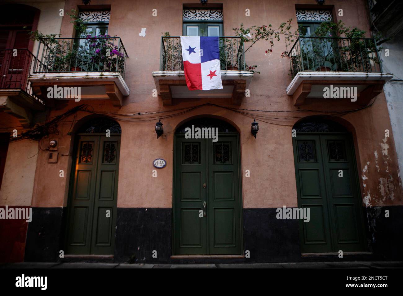 A Panamanian flag hangs from a balcony in the Old Compound of Panama ...