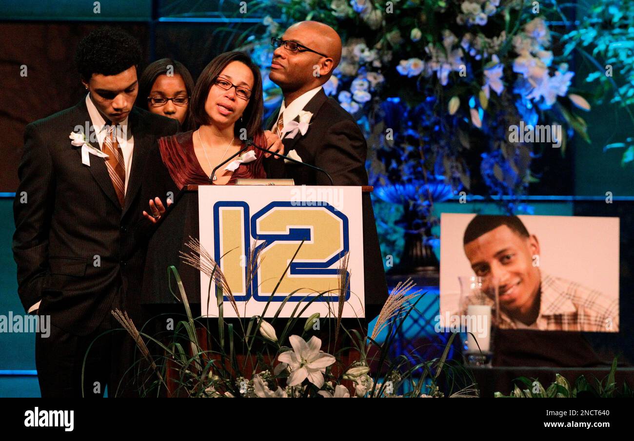 Danroy Henry Sr., right, father of Danroy "D. J." Henry, holds his wife ...