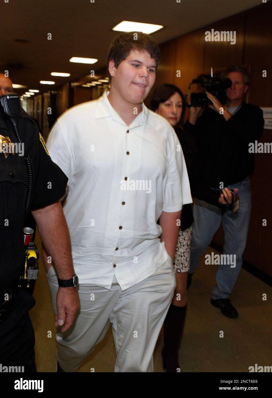 Kyle Ramirez, 18, is escorted by deputies from a San Joaquin County ...