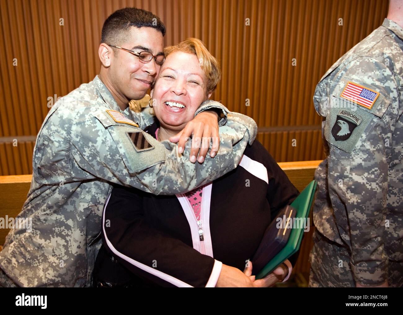Army Spcl. Eliezer Aguilar-Baez, of Waterbury, Conn., hugs his mother ...