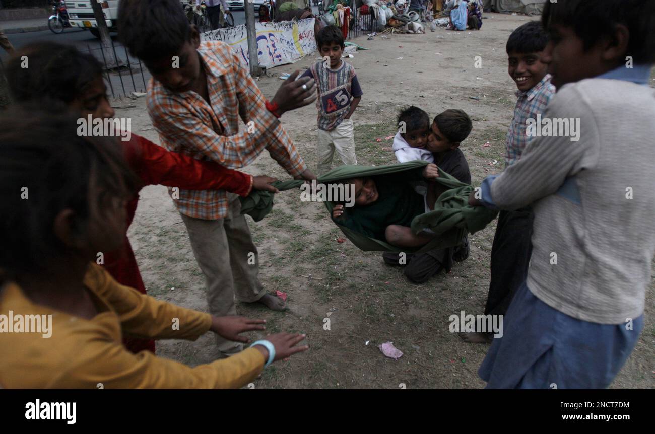 Pakistani kids playing in slums of Lahore, Pakistan on Friday, Oct. 29 ...