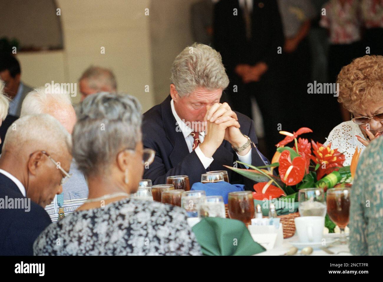 President Bill Clinton prays before lunch with World War II veterans at ...