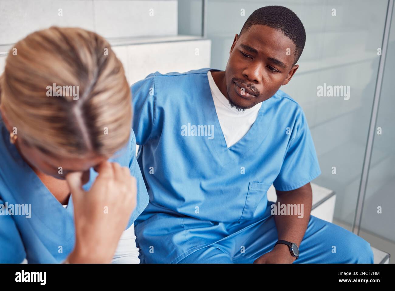 Doctors, nurses or healthcare team with stress and depression talking ...