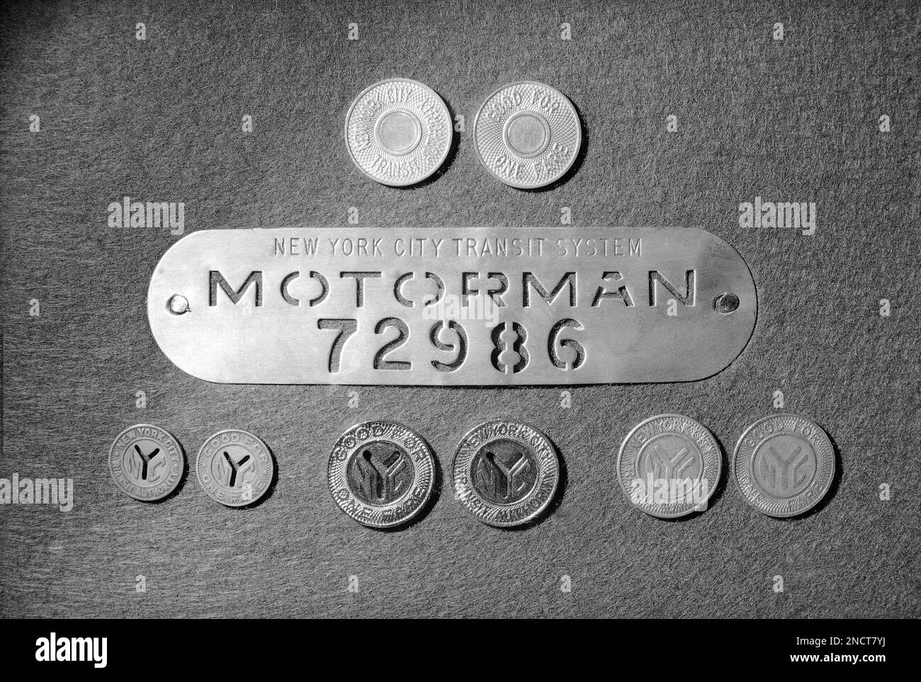 New brass tokens, top row, are contrasted with older versions below at ...