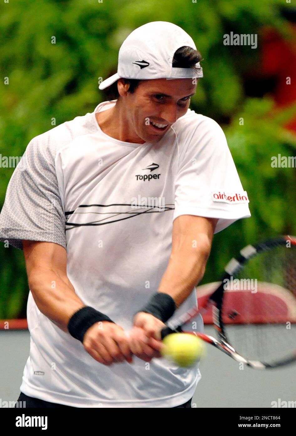Juan Ignacio Chela of Argentina returns the ball to Nicolas Almagro of ...