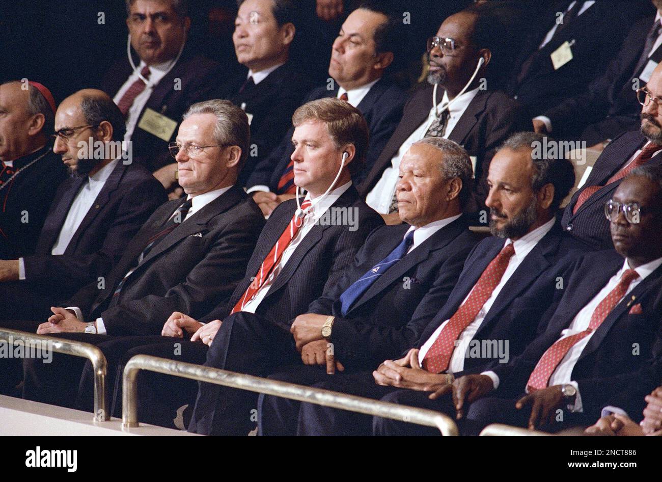 Vice President Dan Quayle, surrounded by unidentified diplomats, wears ...