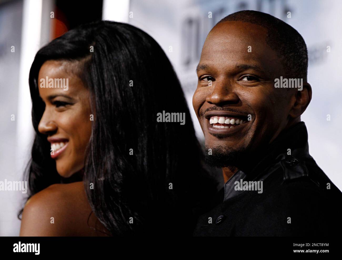 Cast member Jamie Foxx, left, and Britt Loren arrive at the premiere of ...