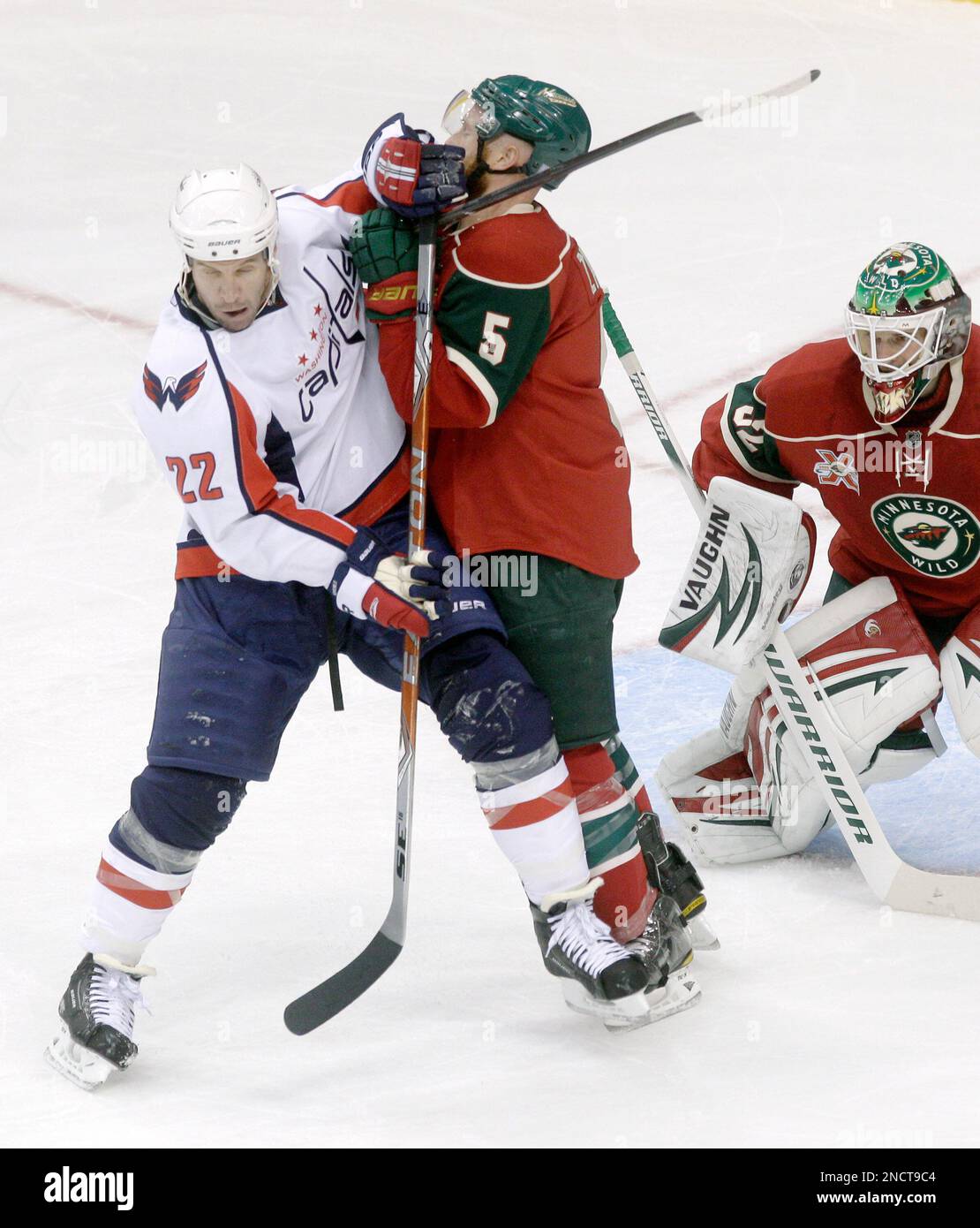 Washington Capitals' Mike Knuble (22) pushes Minnesota Wild' Greg Zanon ...