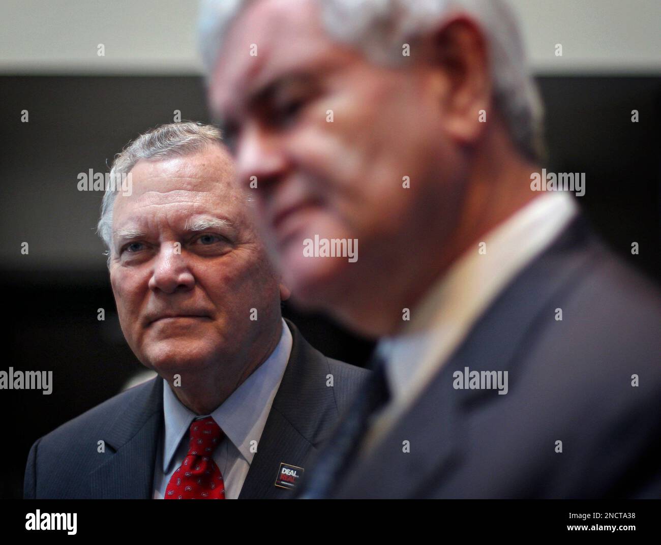 Former Speaker of the House Newt Gingrich, right, speaks to the media ...