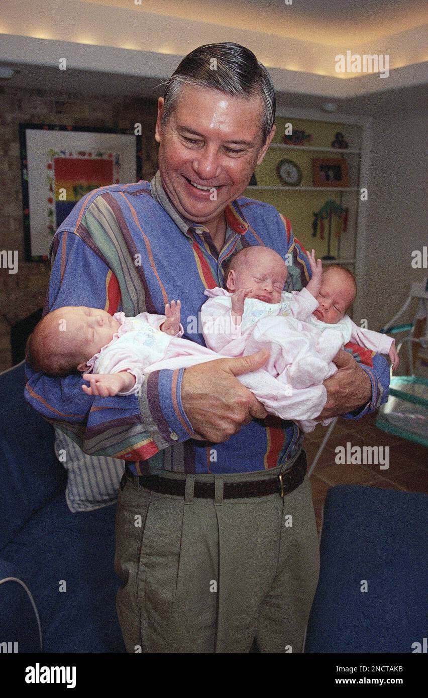 Sen. Bob Graham, D-Fla., holds his triplet granddaughters, from left ...
