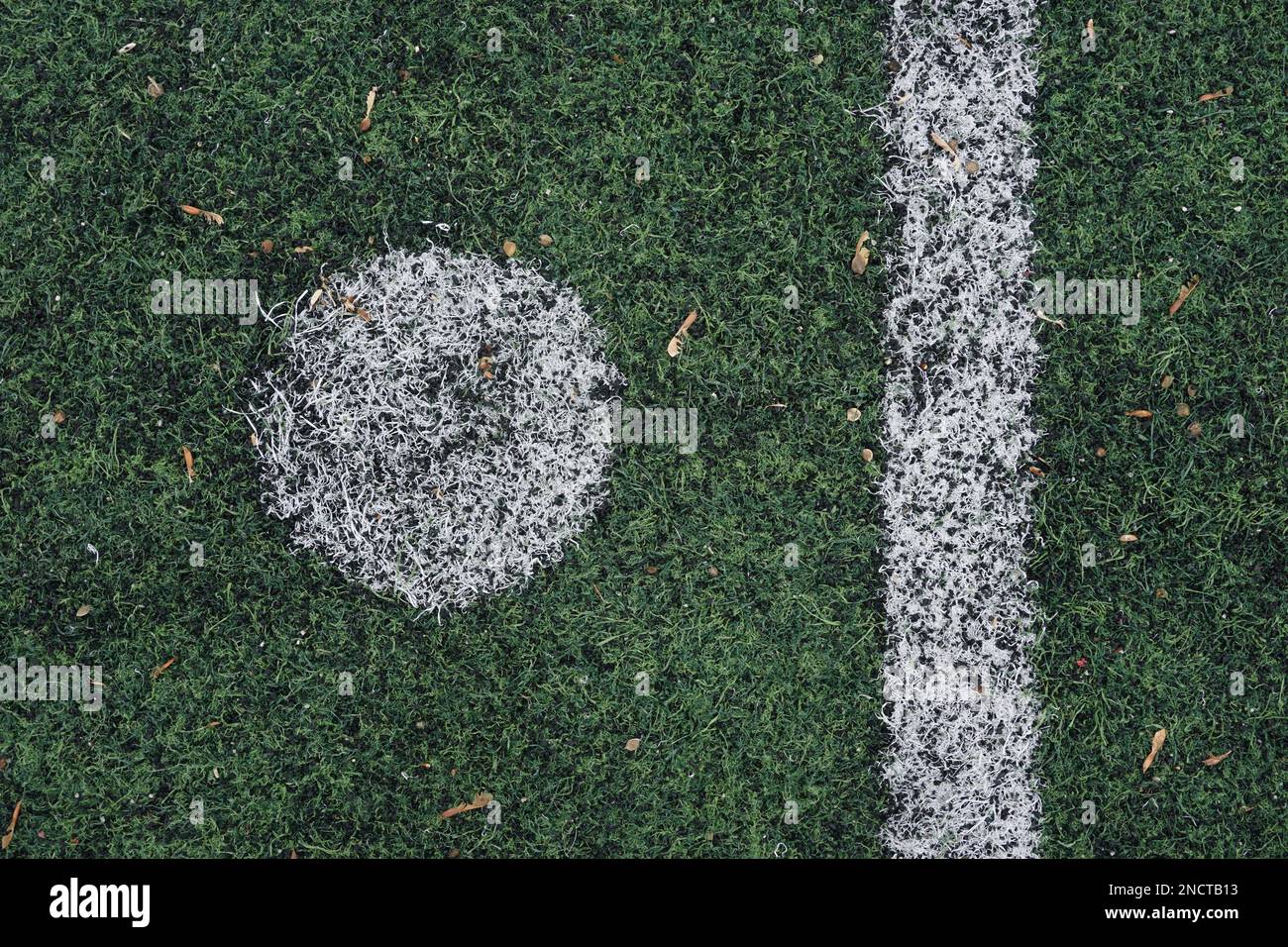 penalty spot, solid white long line and round white point on green ...