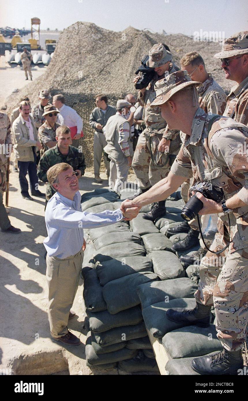 Vice President Dan Quayle reaches to shake hands with U.S. Marine who ...
