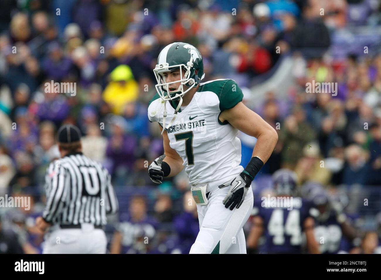 Michigan State's Keith Nichol runs to the sideline during the first ...
