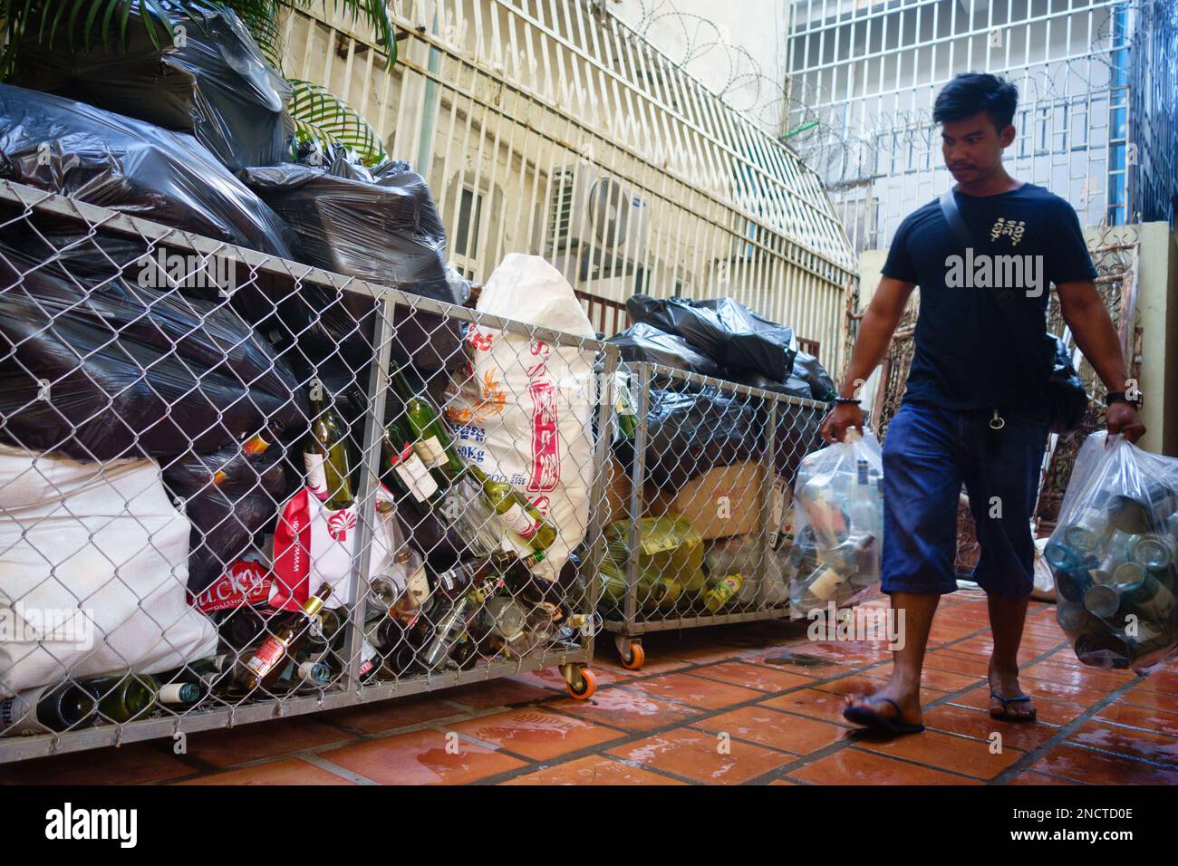 Volunteers in Phnom Penh, Cambodia collect recycling and transport it ...