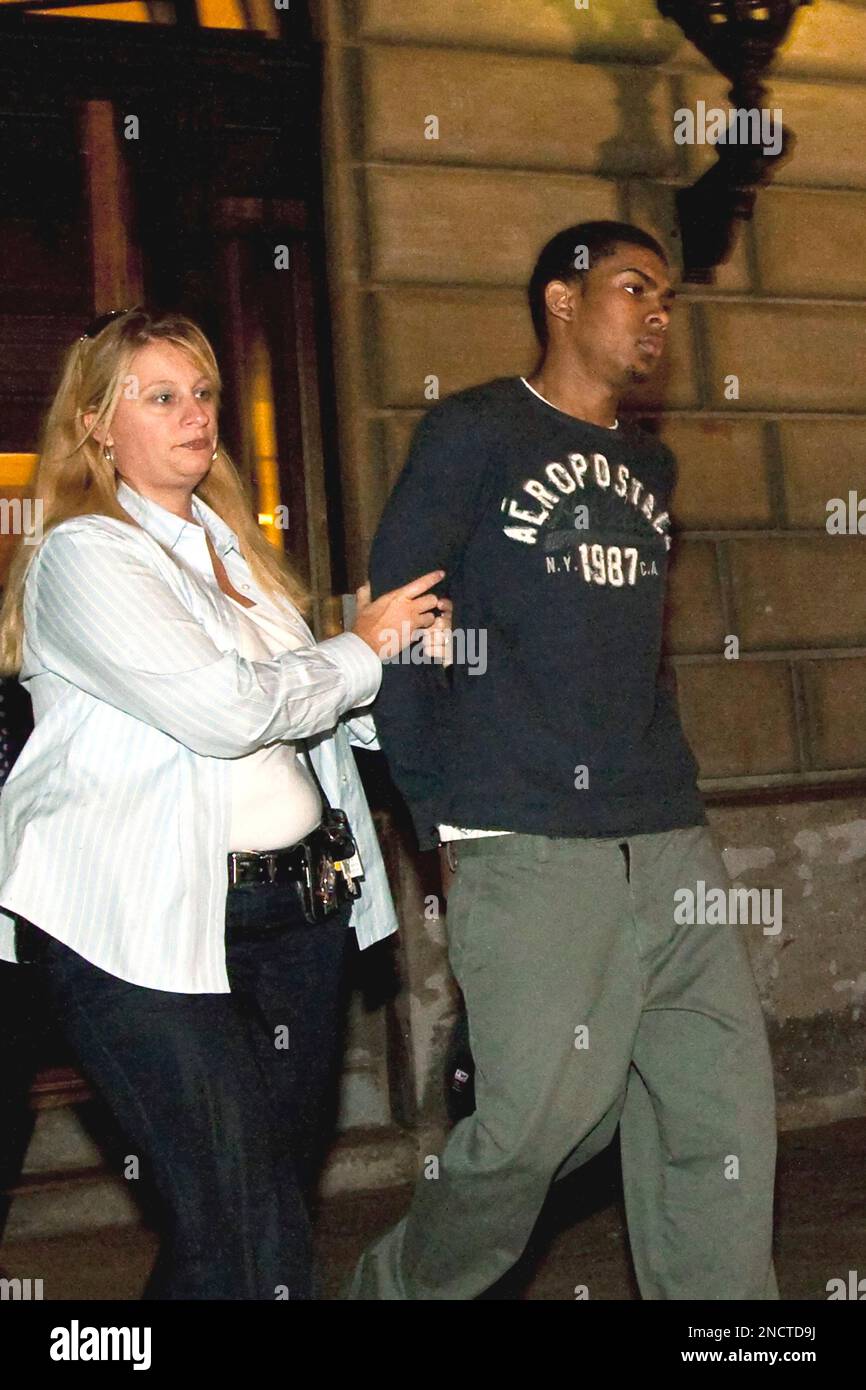 FILE- Oct. 9, 2010 file photo, Dennis Piters is lead out of the Bronx ...
