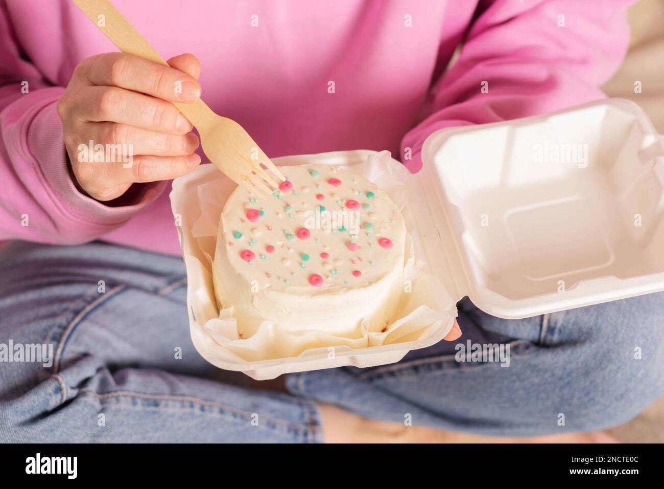Woman is holding bento cake in her hands. Korean style cakes in box for ...