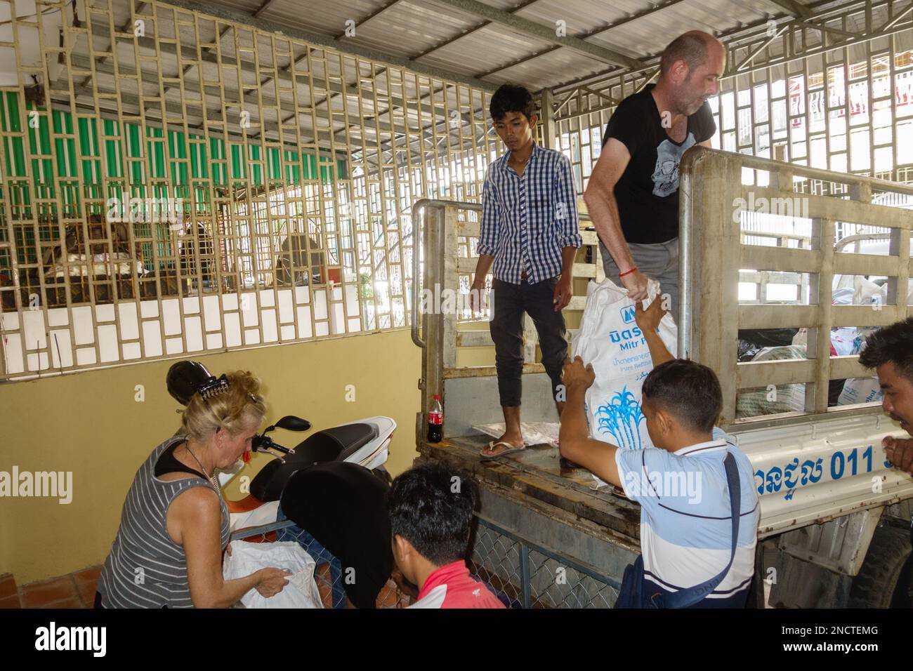 Volunteers in Phnom Penh, Cambodia collect recycling and transport it ...
