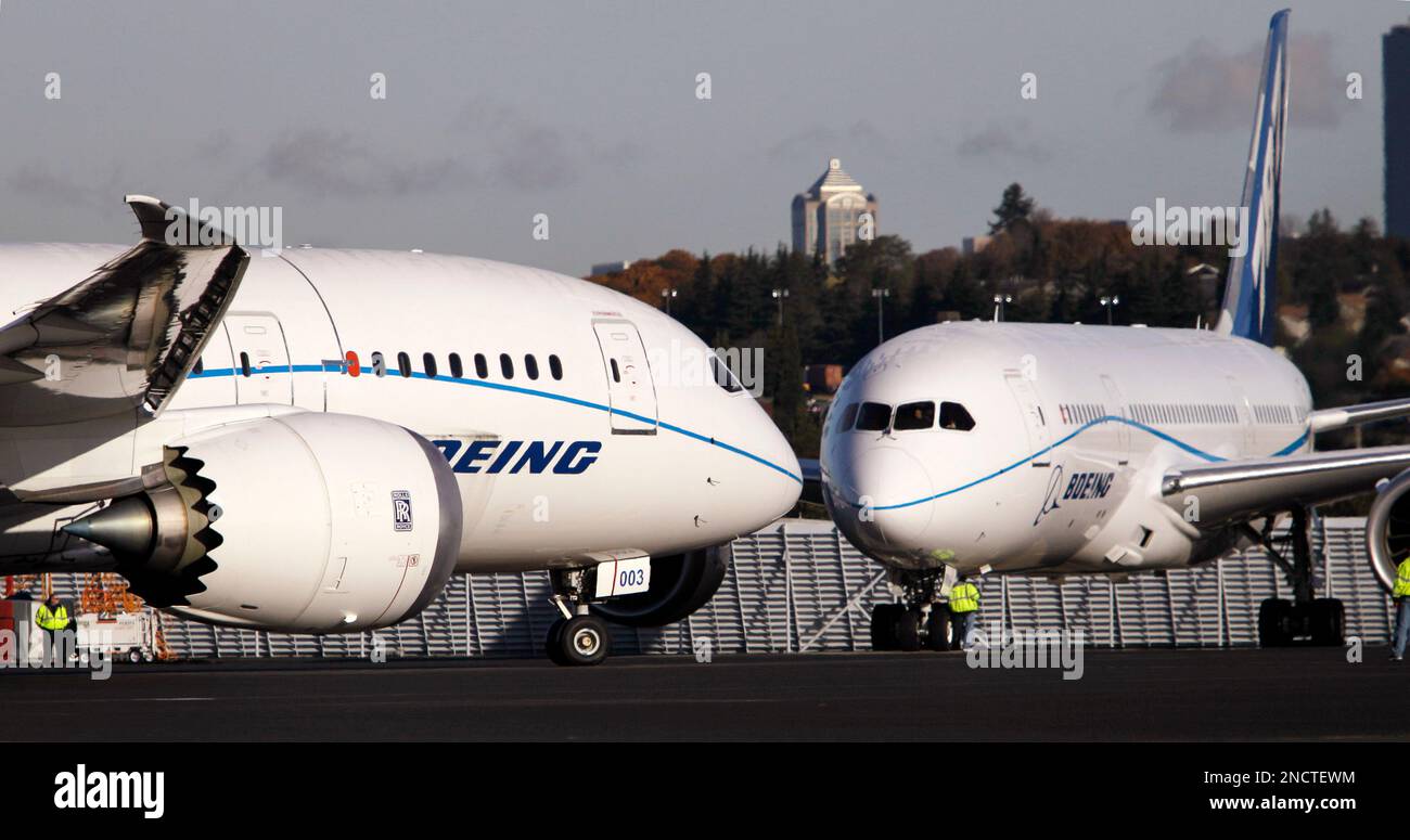 One test model Boeing 787 passes another on the tarmac before a flight ...
