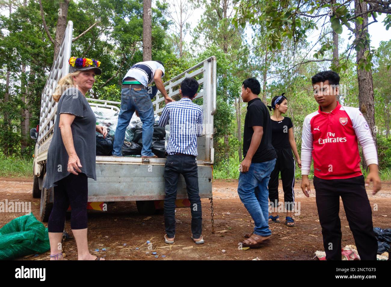 Volunteers in Phnom Penh, Cambodia collect recycling and transport it ...