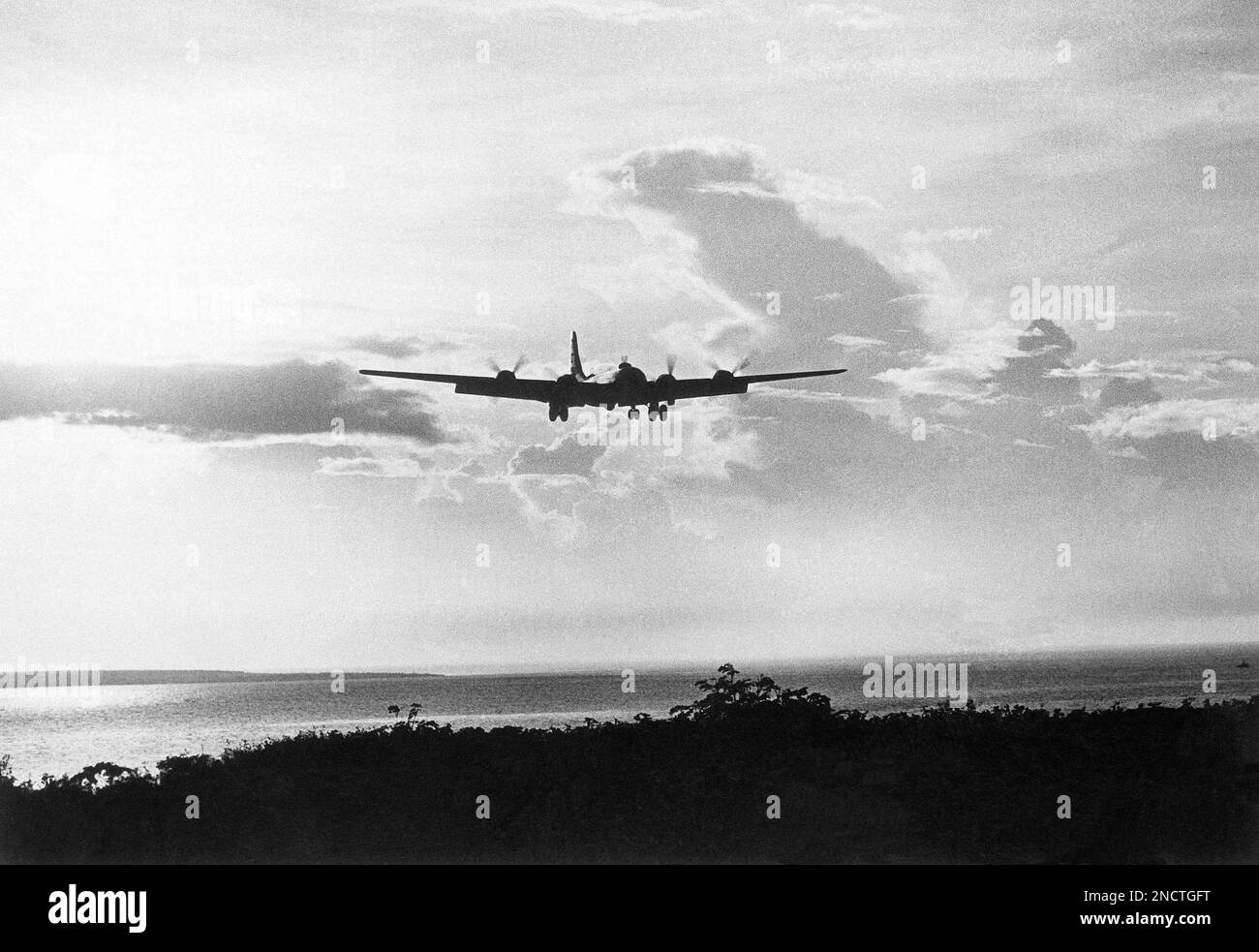 Its giant flaps and wheels down, a 21st Bomber Command B-29 ...
