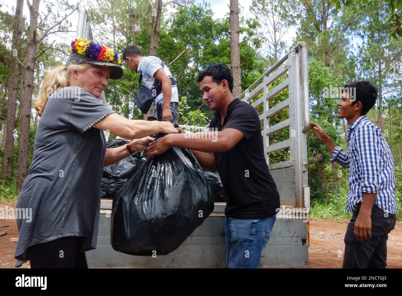 Volunteers in Phnom Penh, Cambodia collect recycling and transport it ...