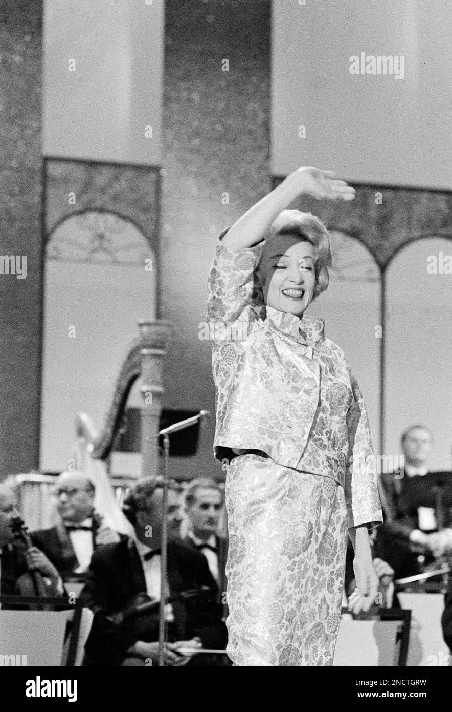 German-born actress-singer Marlene Dietrich wave back to audience, who ...