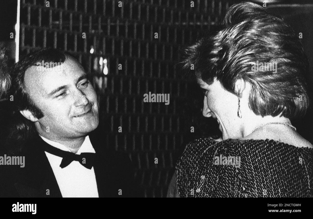 Singer Phil Collins chats with the Princess of Wales, at the charity ...
