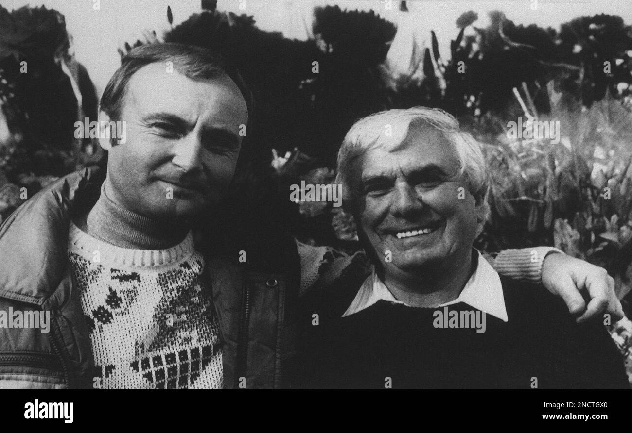 Pop star Phil Collins, left, shown with Ronald (Buster) Edwards, right ...