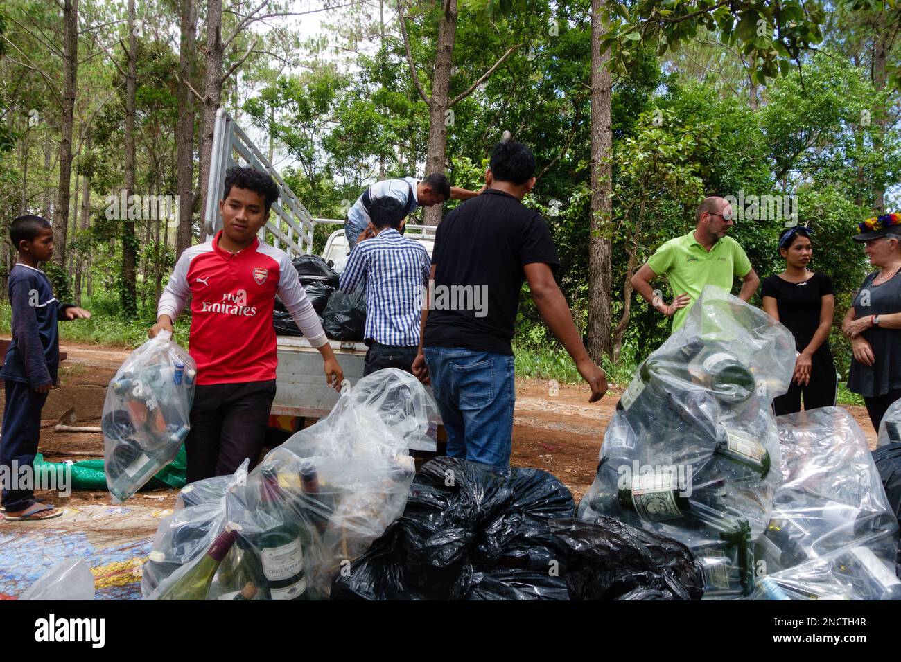 Volunteers in Phnom Penh, Cambodia collect recycling and transport it ...