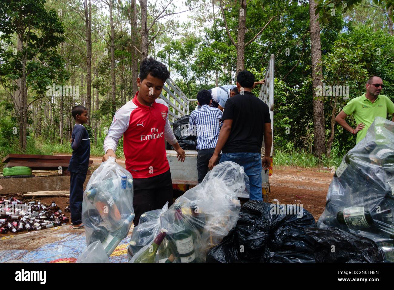 Volunteers in Phnom Penh, Cambodia collect recycling and transport it ...