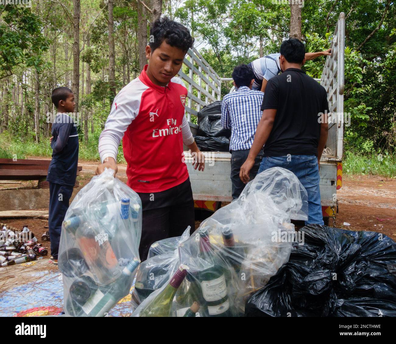 Volunteers in Phnom Penh, Cambodia collect recycling and transport it ...
