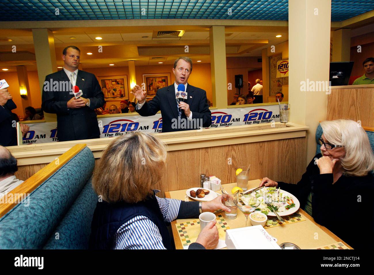 Diners at Ponzio's in Cherry Hill, N.J., listen Tuesday, Oct. 26, 2010 ...