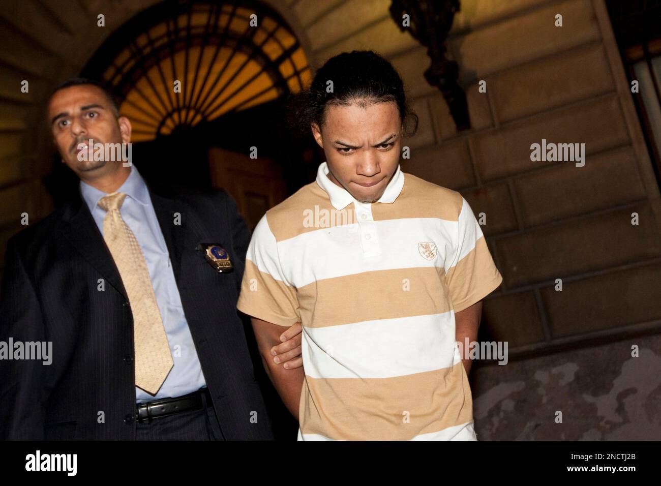 FILE- In this Oct. 11, 2010 file photo, Brian Cepeda is lead out of the ...