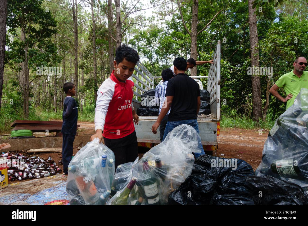 Volunteers in Phnom Penh, Cambodia collect recycling and transport it ...