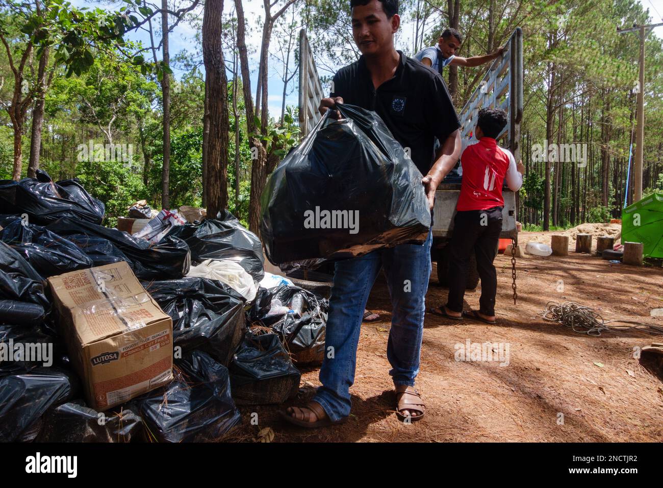 Volunteers in Phnom Penh, Cambodia collect recycling and transport it ...