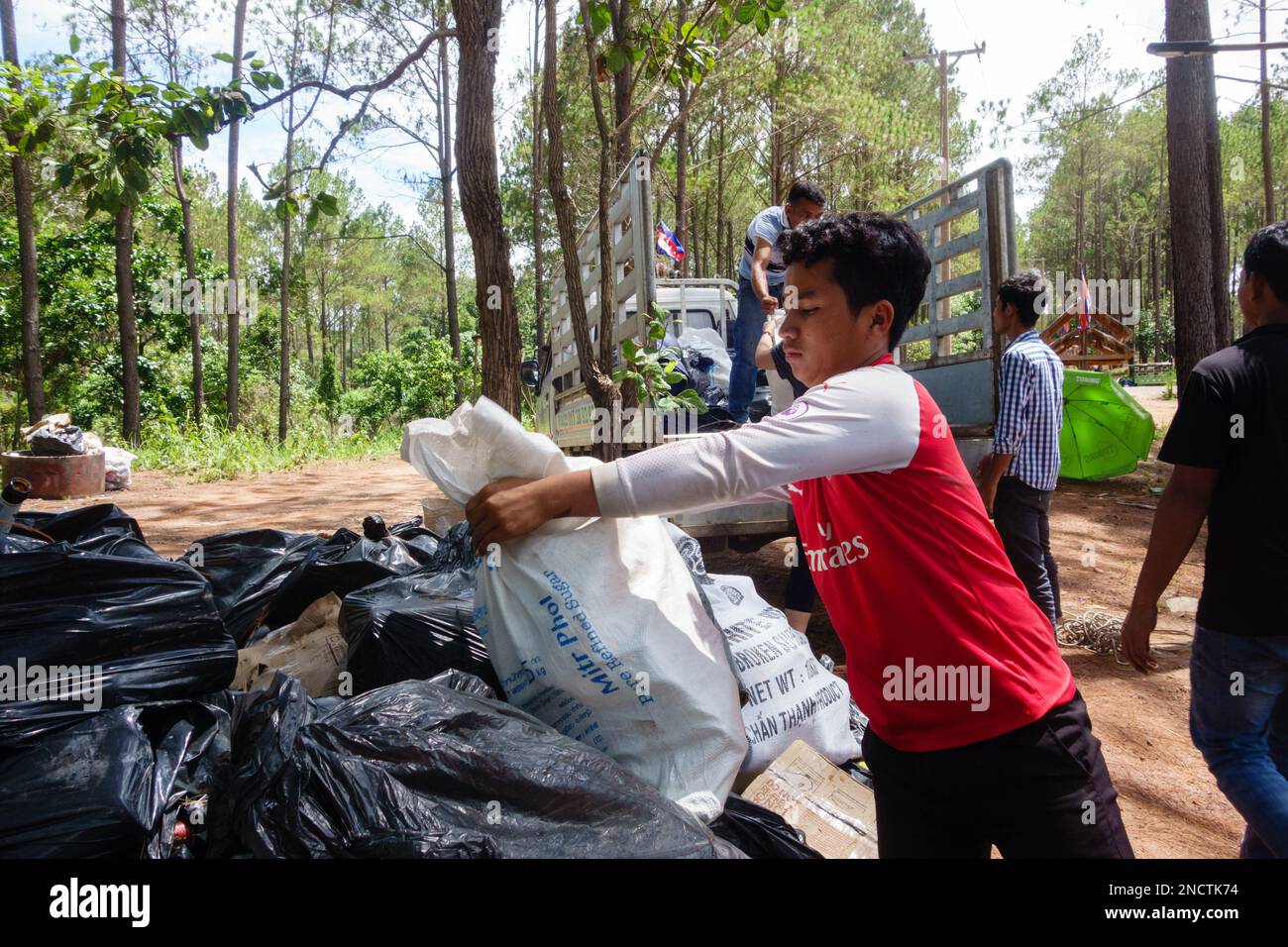Volunteers in Phnom Penh, Cambodia collect recycling and transport it ...