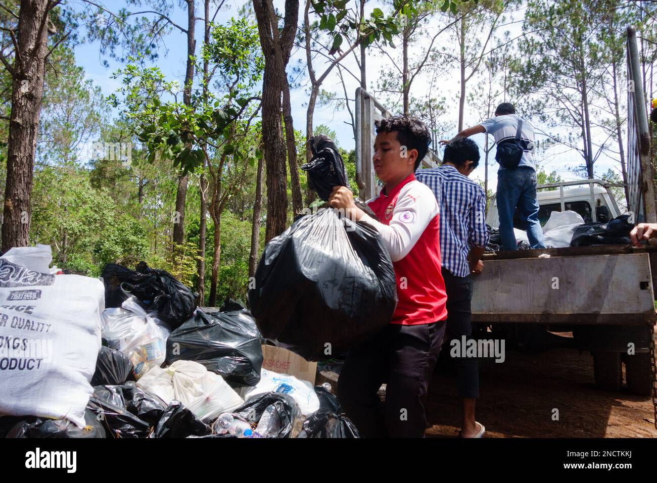 Volunteers in Phnom Penh, Cambodia collect recycling and transport it ...