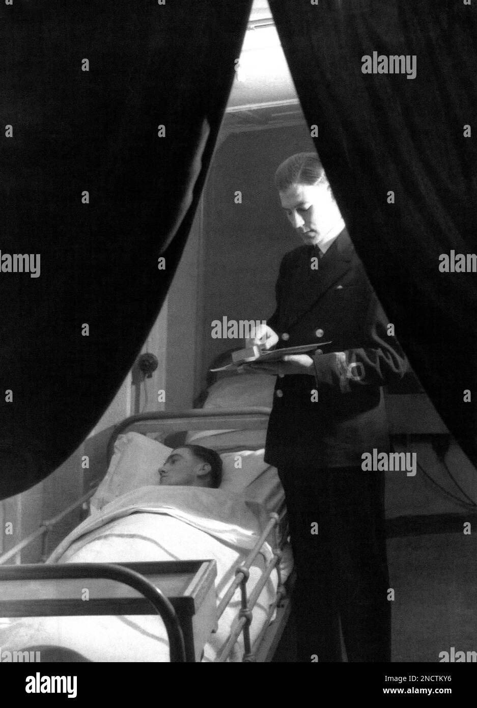 The doctor on board a British rescue ship attends to a survivor on May ...