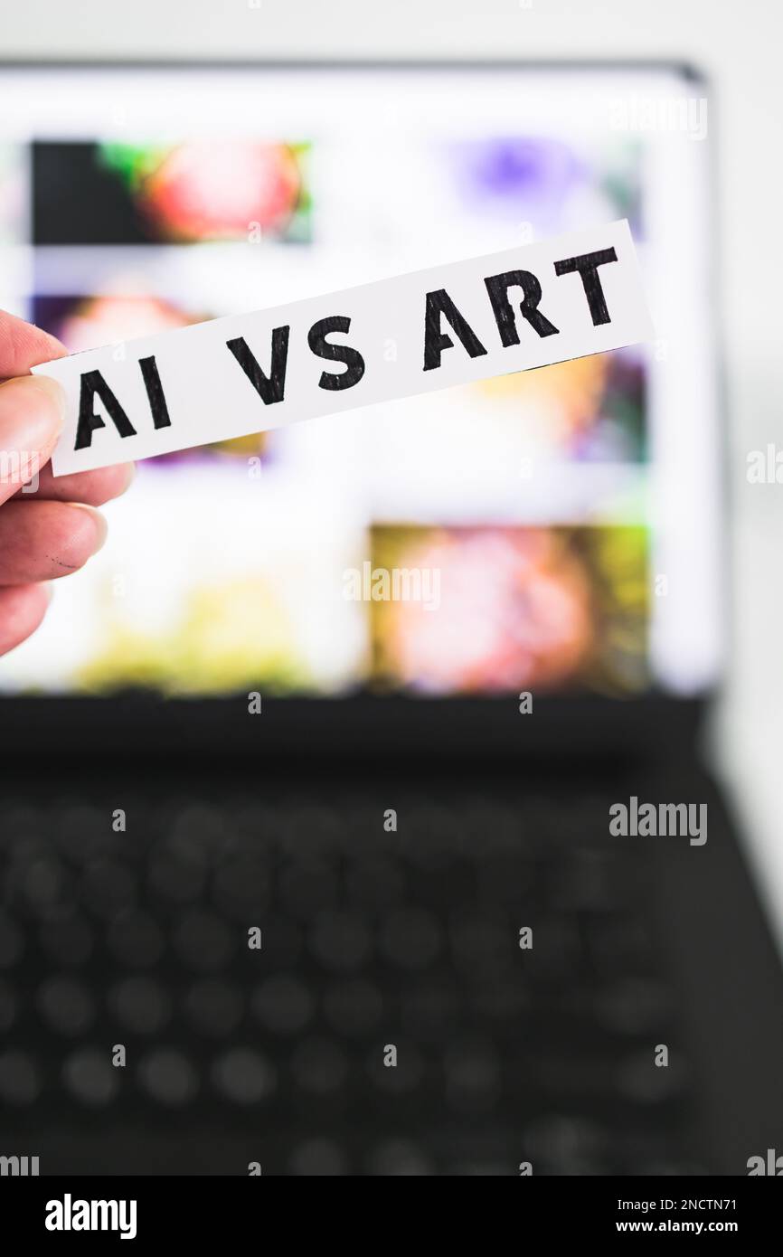 AI vs Art text in front of laptop bokeh with out of focus images ...