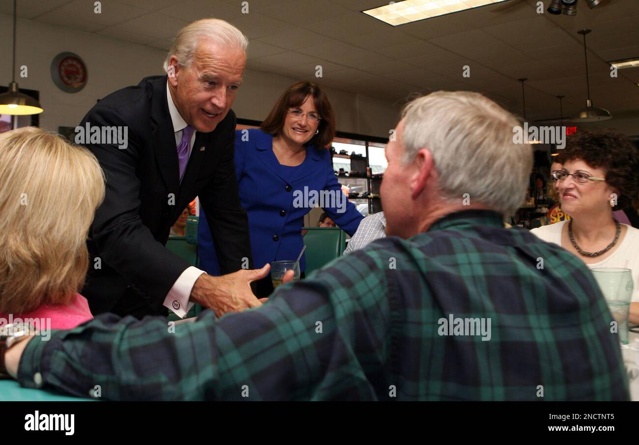 Vice President Joe Biden reaches out to shake hands as he campaigns for ...
