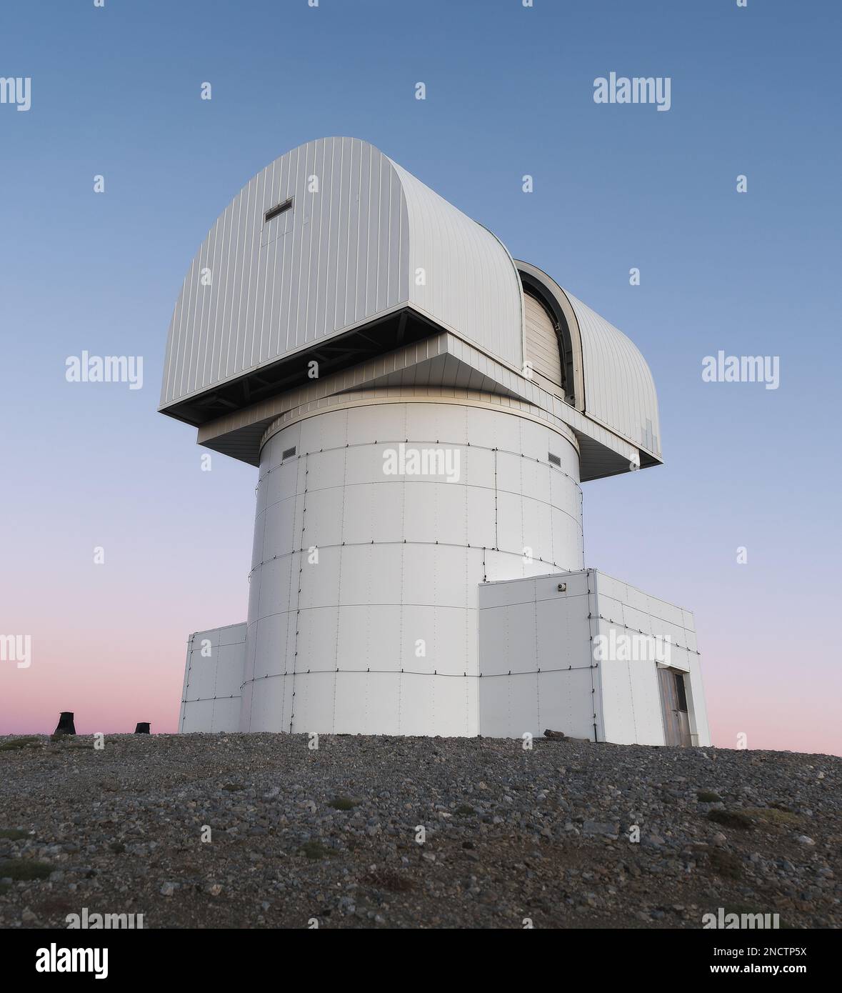 A large white telescope in an arid desert landscape Stock Photo - Alamy