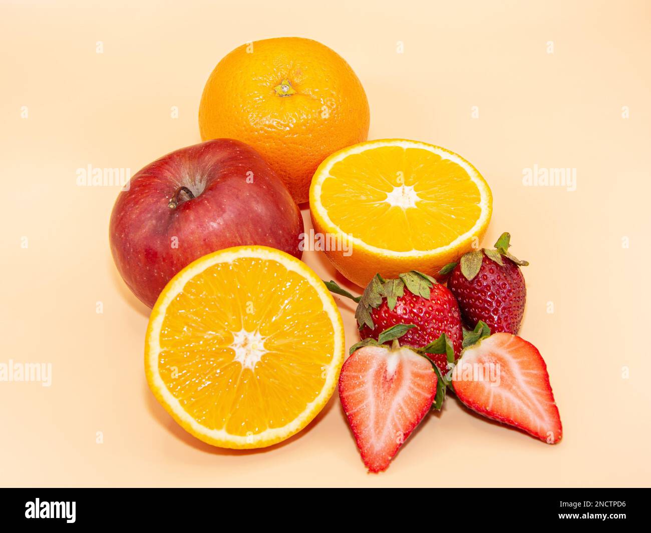 A view of different fruit in beige background Stock Photo - Alamy