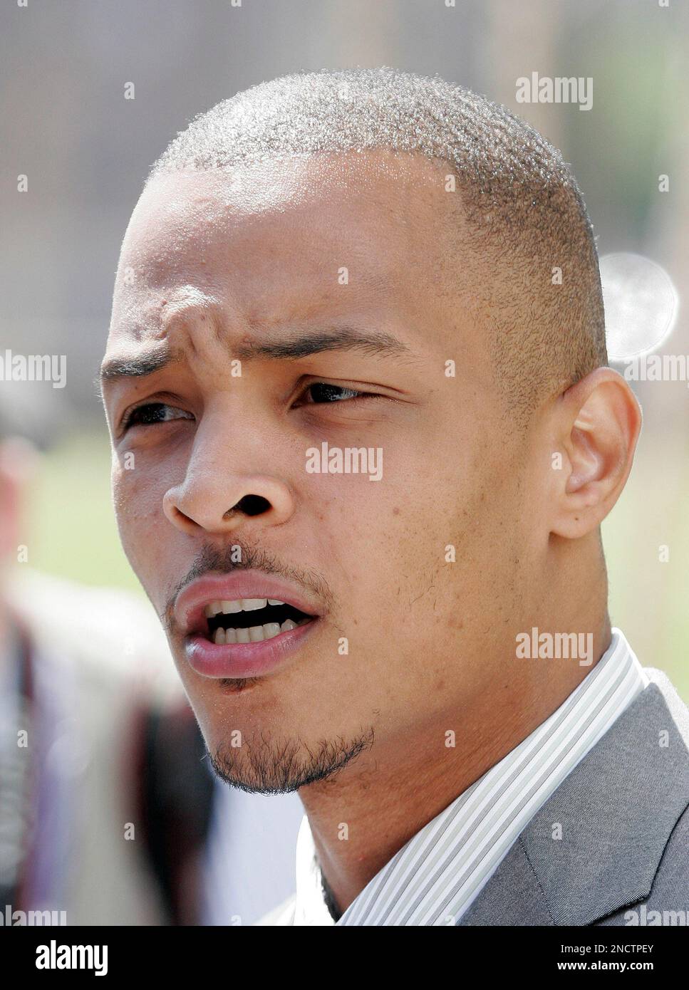 FILE - Rapper T.I. whose real name is Clifford Harris speaks to reporters outside the Richard B ...