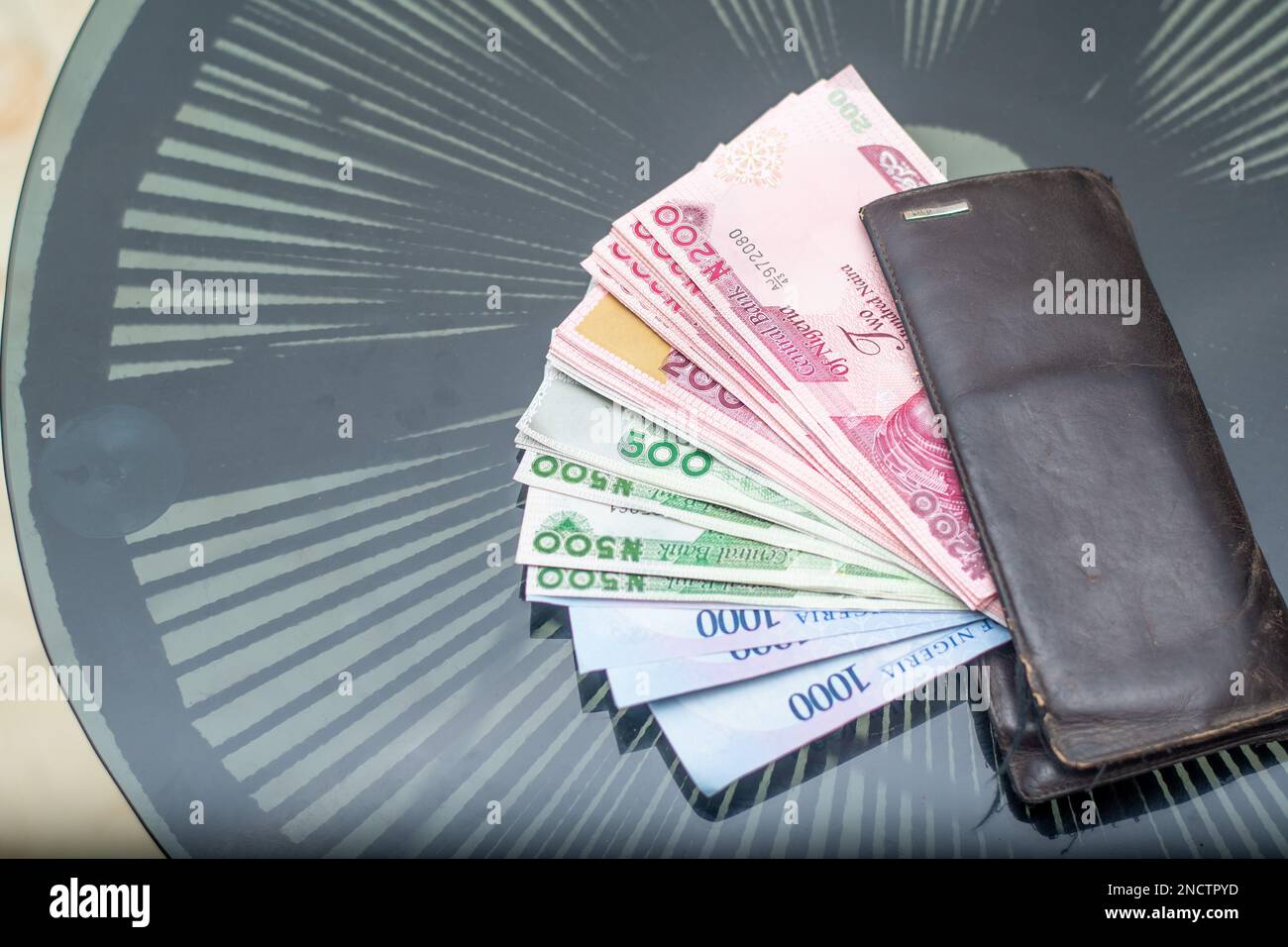 the new nigerian naira notes in a wallet Stock Photo - Alamy
