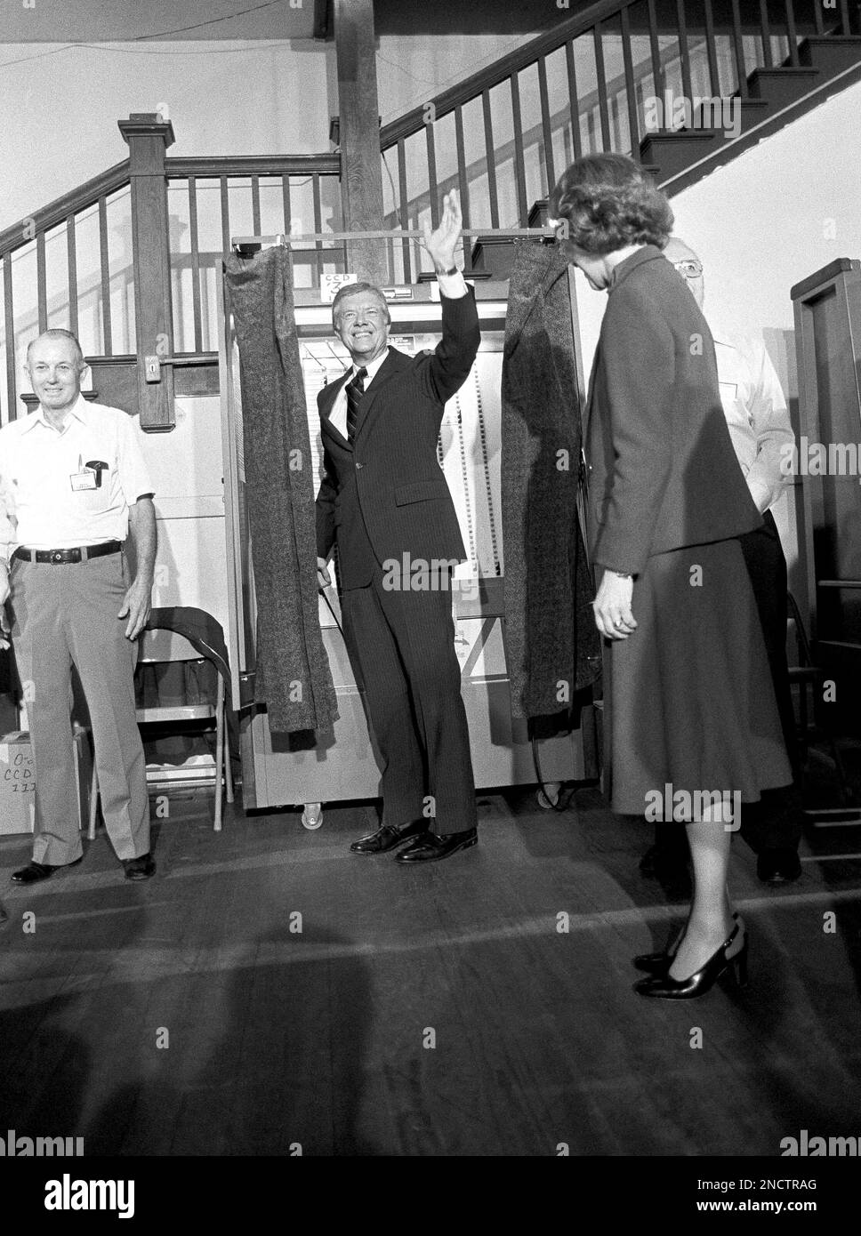 U.S. President Jimmy Carter smiles and waves as he comes out of the ...