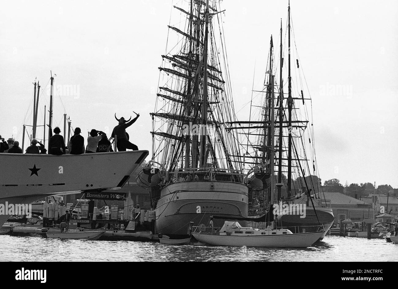 Tourist gives a Viking salute to the Danish tall ship Danmark as she ...