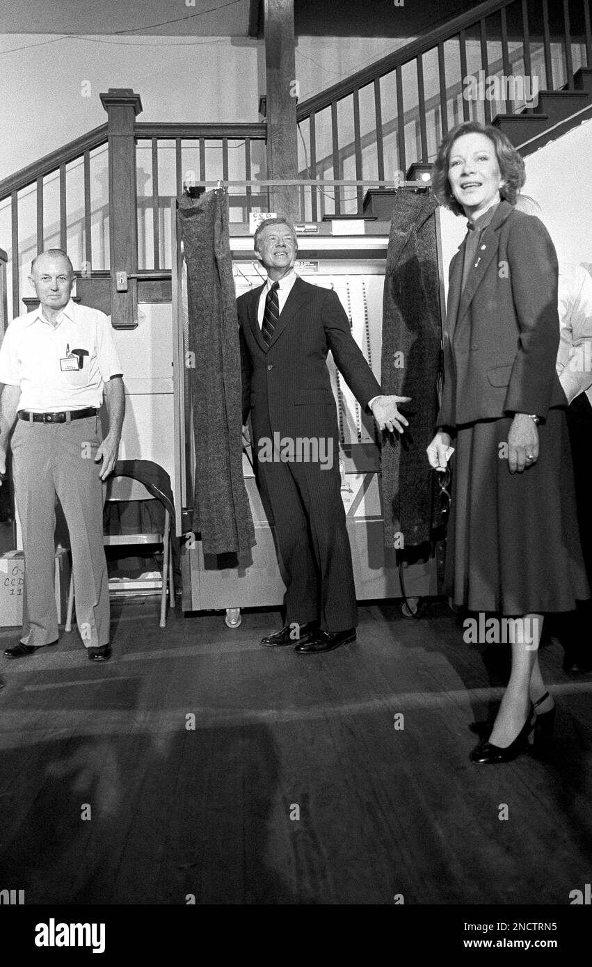 U.S. President Jimmy Carter gestures from the voting booth after ...