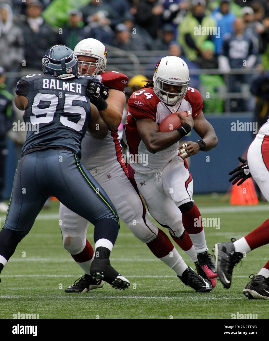 Seattle Seahawks’ Kentwan Balmer (95) is blocked as Arizona Cardinals ...