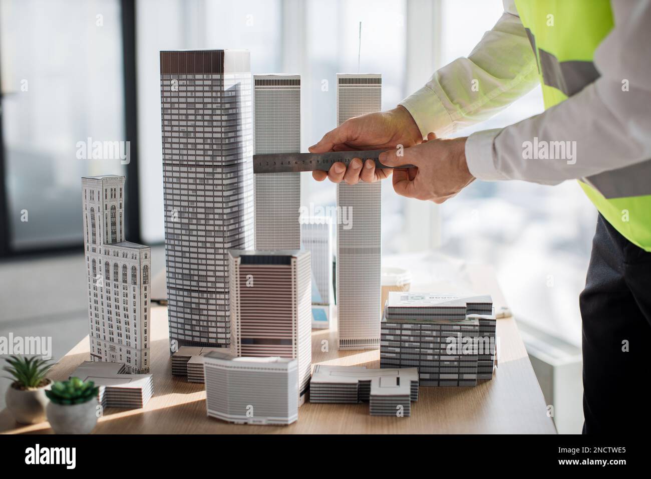 Cropped view of hands of engineer working on building complex prototype ...