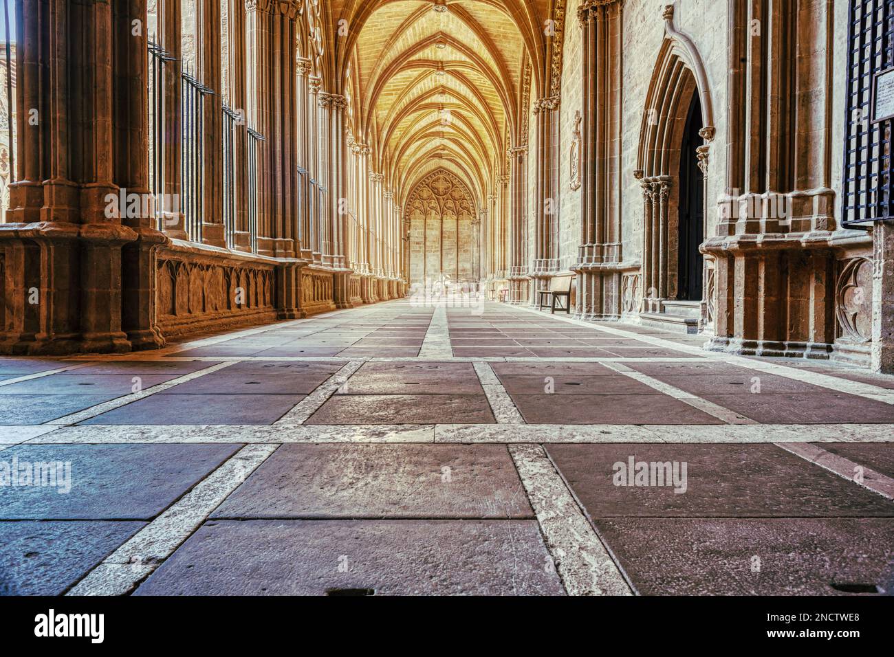 View of the ornate gothic cloister arcade arches of the Catholic ...